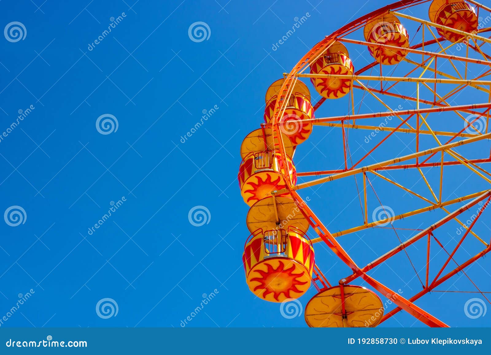 Yellow Ferris Wheel Against a Blue Sky. Space for Your Text Stock Photo ...