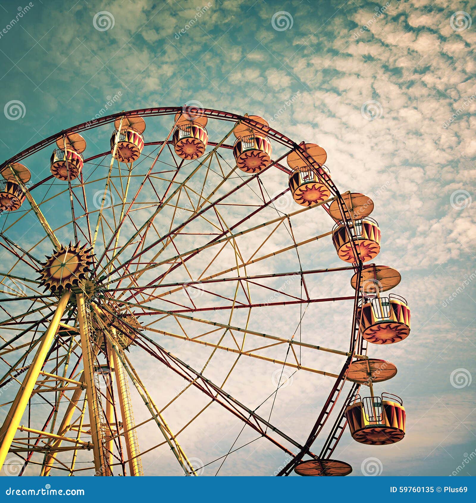 Yellow Ferris Wheel Against a Blue Sky in Vintage Style Stock Image ...