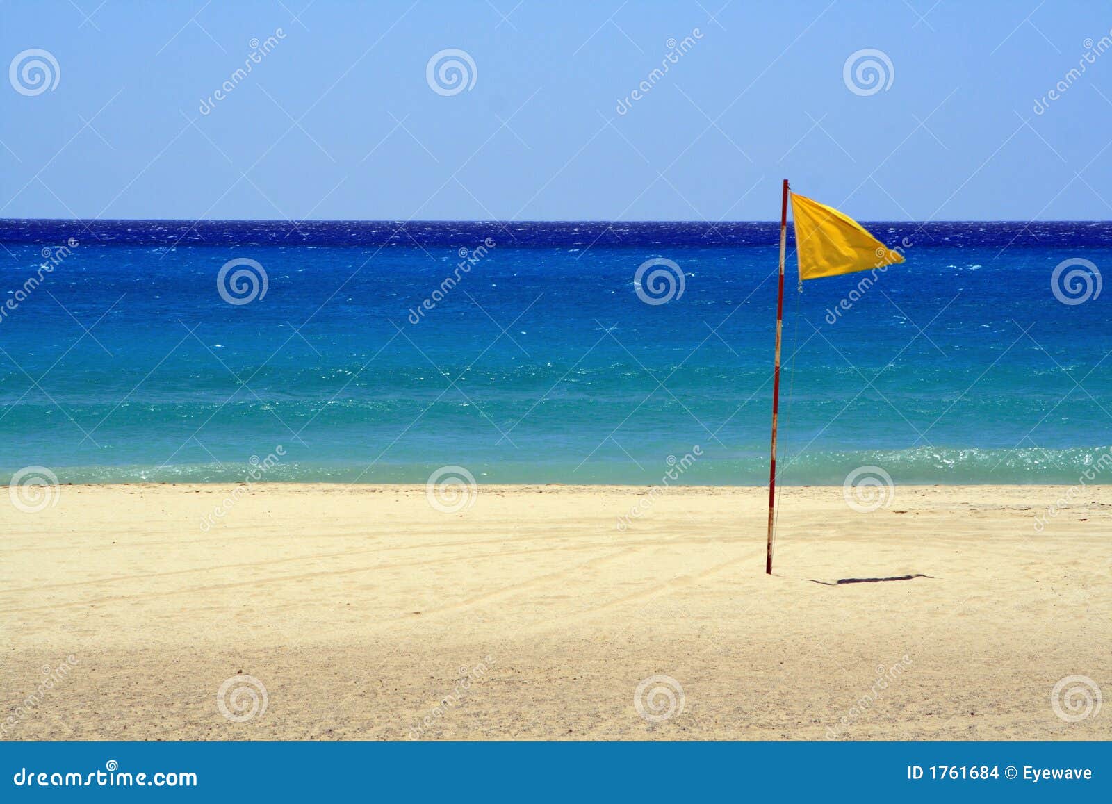 Yellow flag at beach stock photo. Image of vacation, waves - 1761684