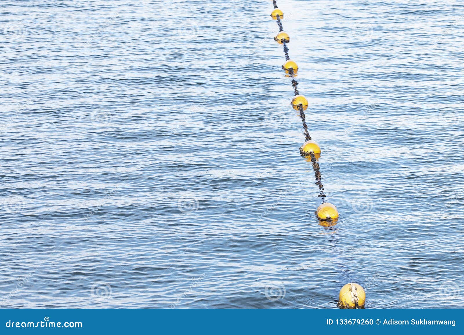Yellow Float Floats on a Rope Floating in the Sea Stock Photo - Image ...