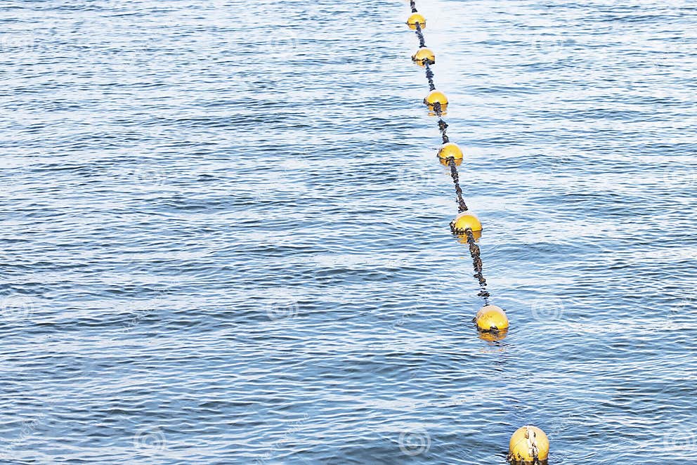 Yellow Float Floats on a Rope Floating in the Sea Stock Photo - Image ...