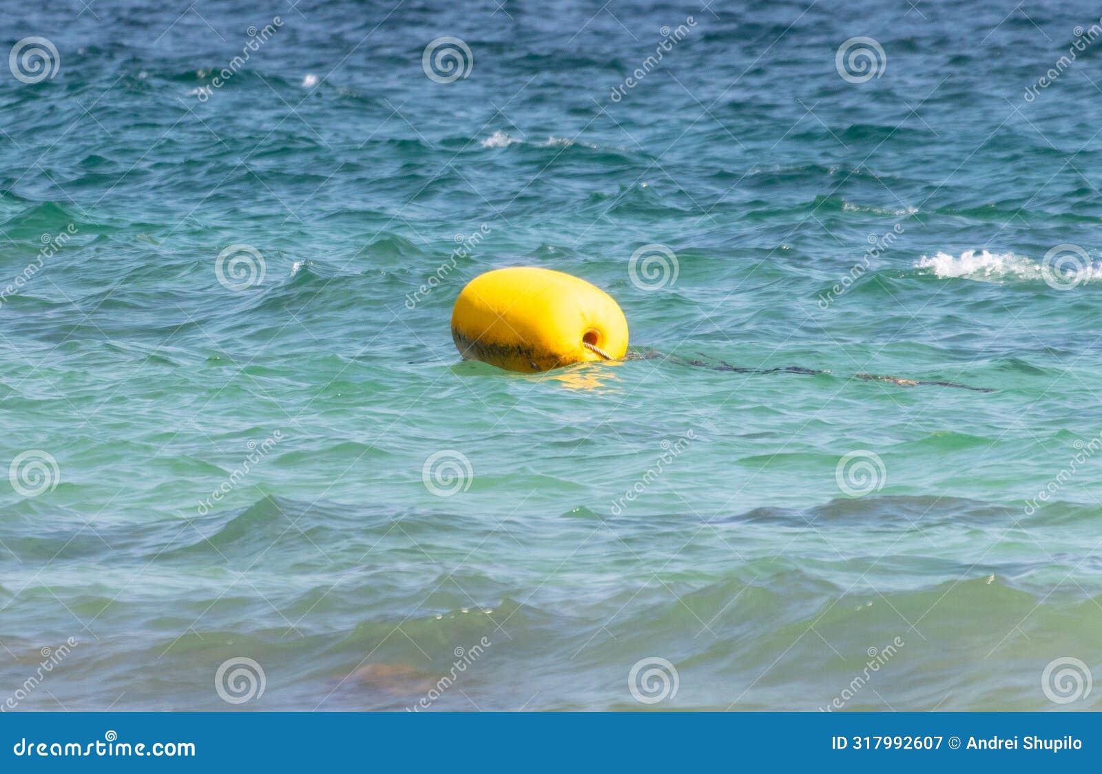 A Yellow Float Floats in the Sea Stock Image - Image of sandy, buoy ...