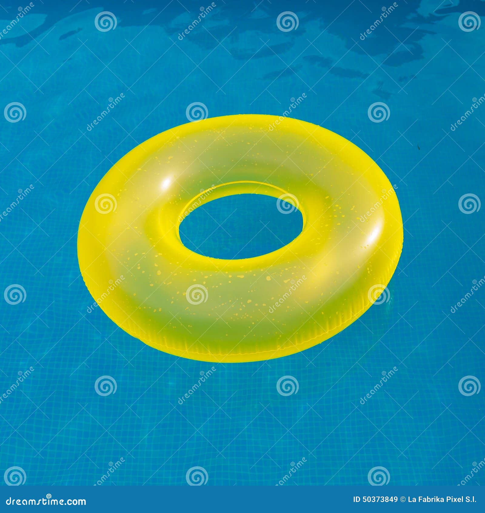 Yellow floater on the pool stock image. Image of floating - 50373849