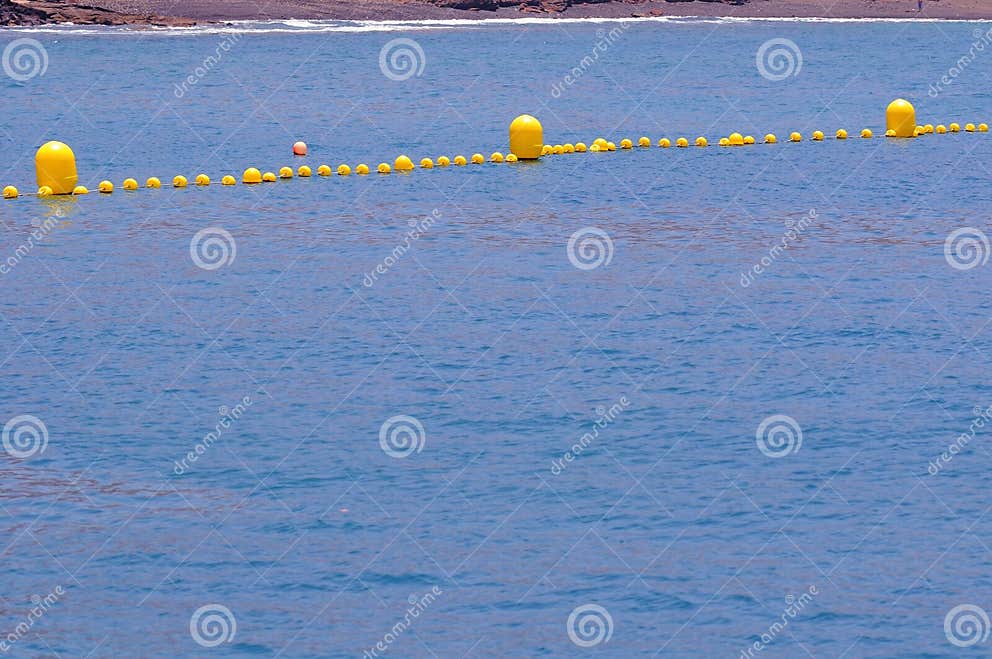 Yellow Floaters stock image. Image of swimming, blue - 33632687