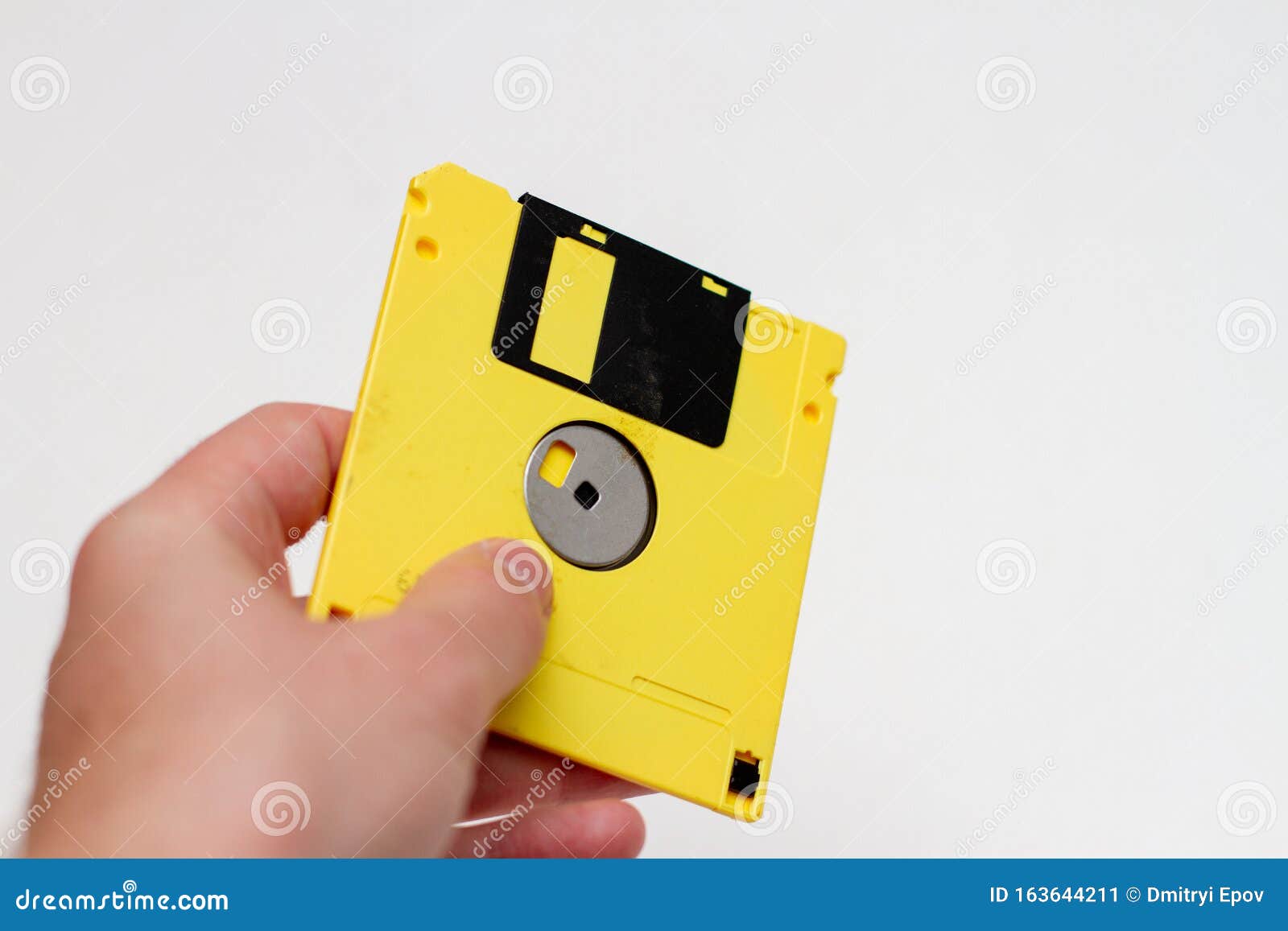 Yellow Floppy Disk in Hand. Magnetic Disk Memory Drive Stock Image ...