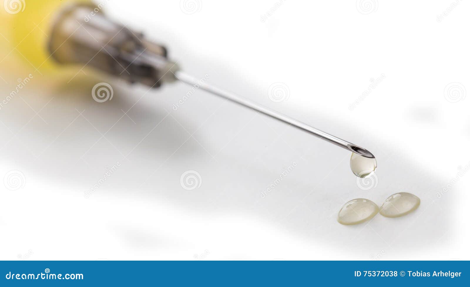 Yellow Fluid Coming Out of a Syrenge Injection Needle Stock Photo ...