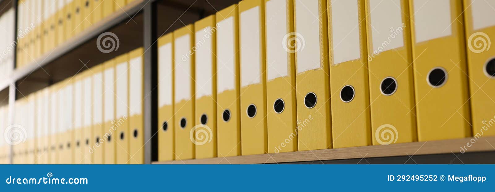 Yellow Folders with Materials Put in Long Rows on Shelves Stock Photo ...