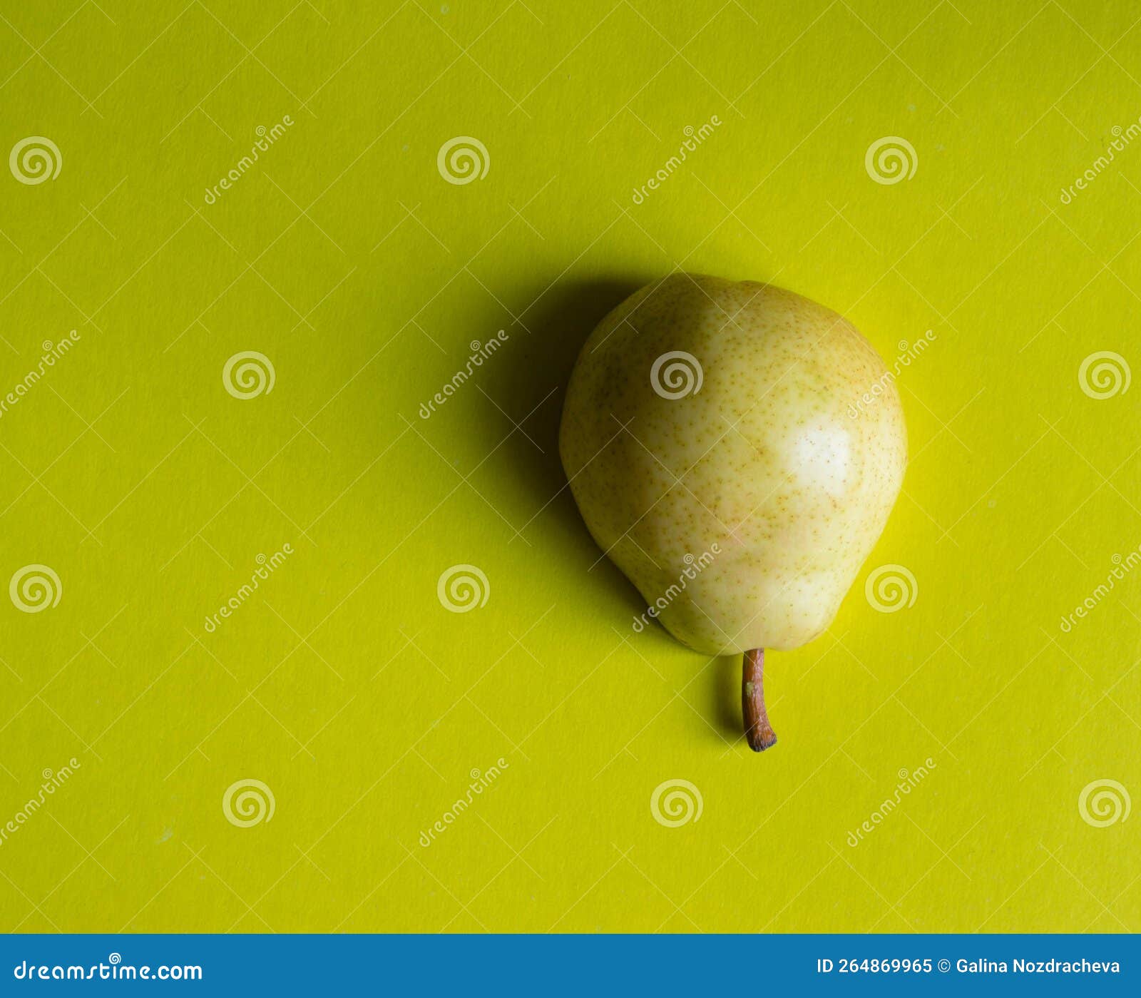 Yellow Fresh Pear Cut in Half on Yellow Background. Top View Stock ...