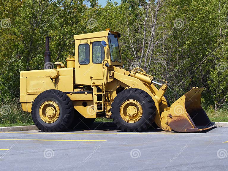 Yellow front end loader stock image. Image of loader, pivot - 936377