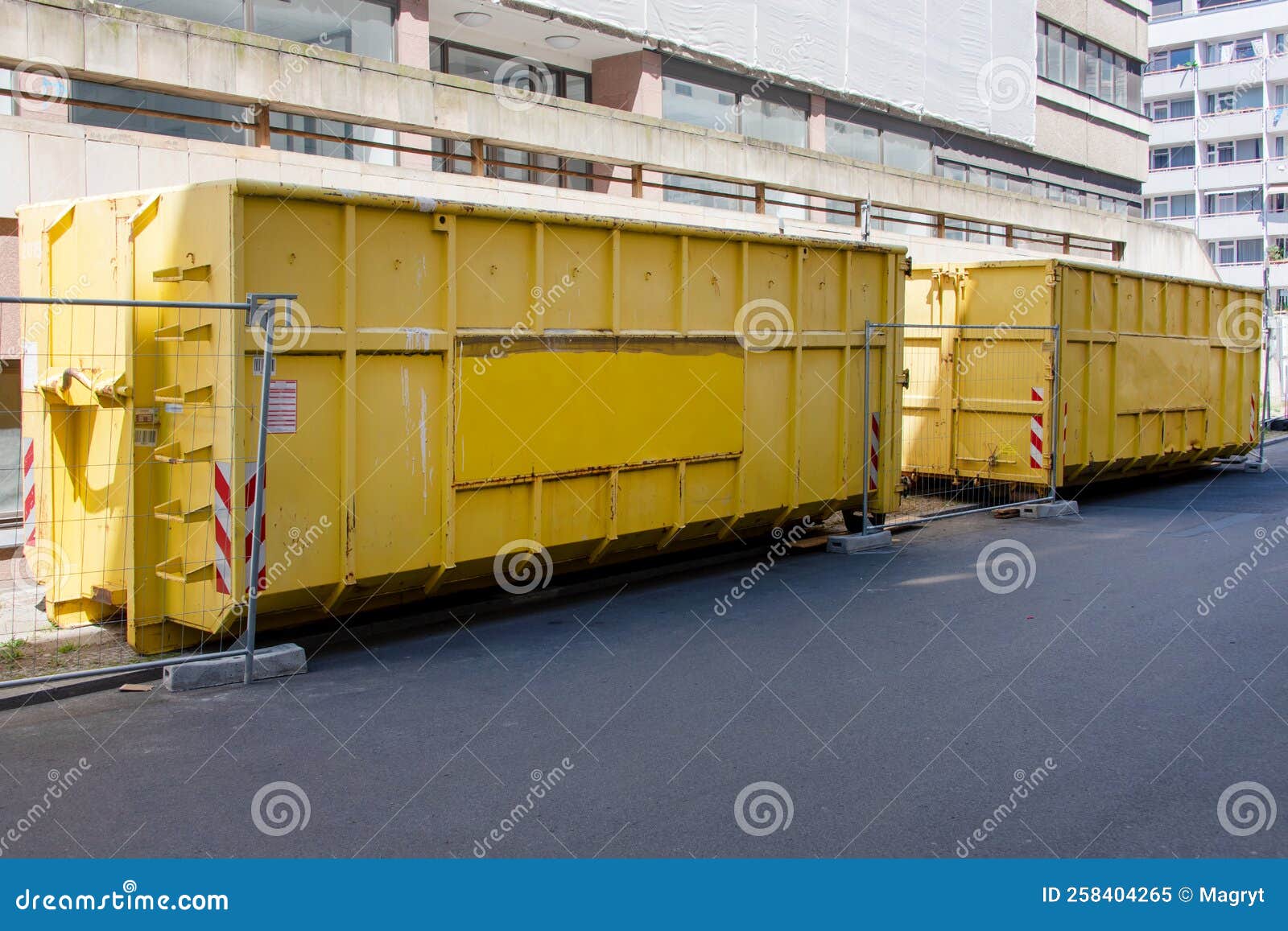 Yellow Garbage Containers Near the Building, Construction Site on the ...