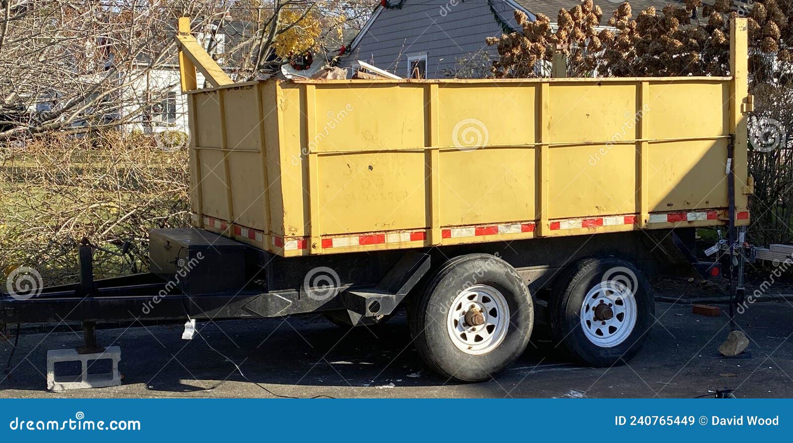 Yellow Dumpster on a Trailer in a Driveway Stock Image - Image of ...