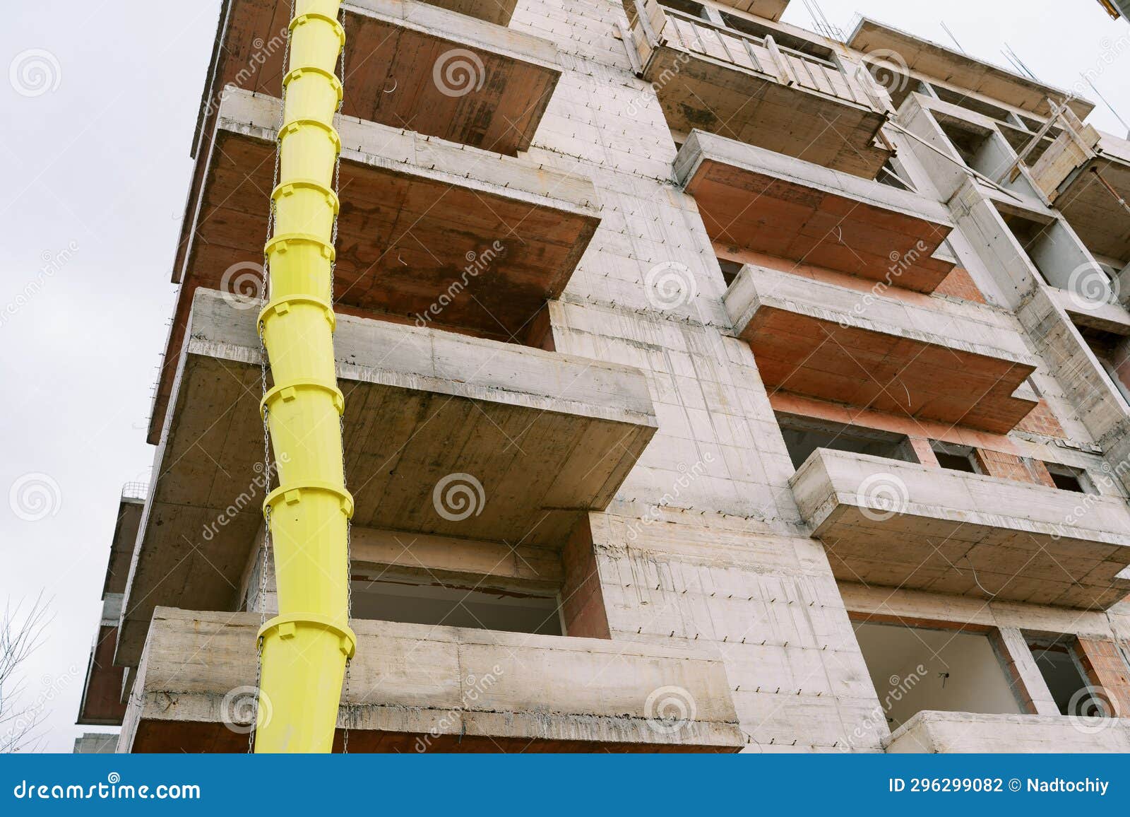 Yellow Garbage Pipe is Attached To the Outer Wall of a Multi-storey ...
