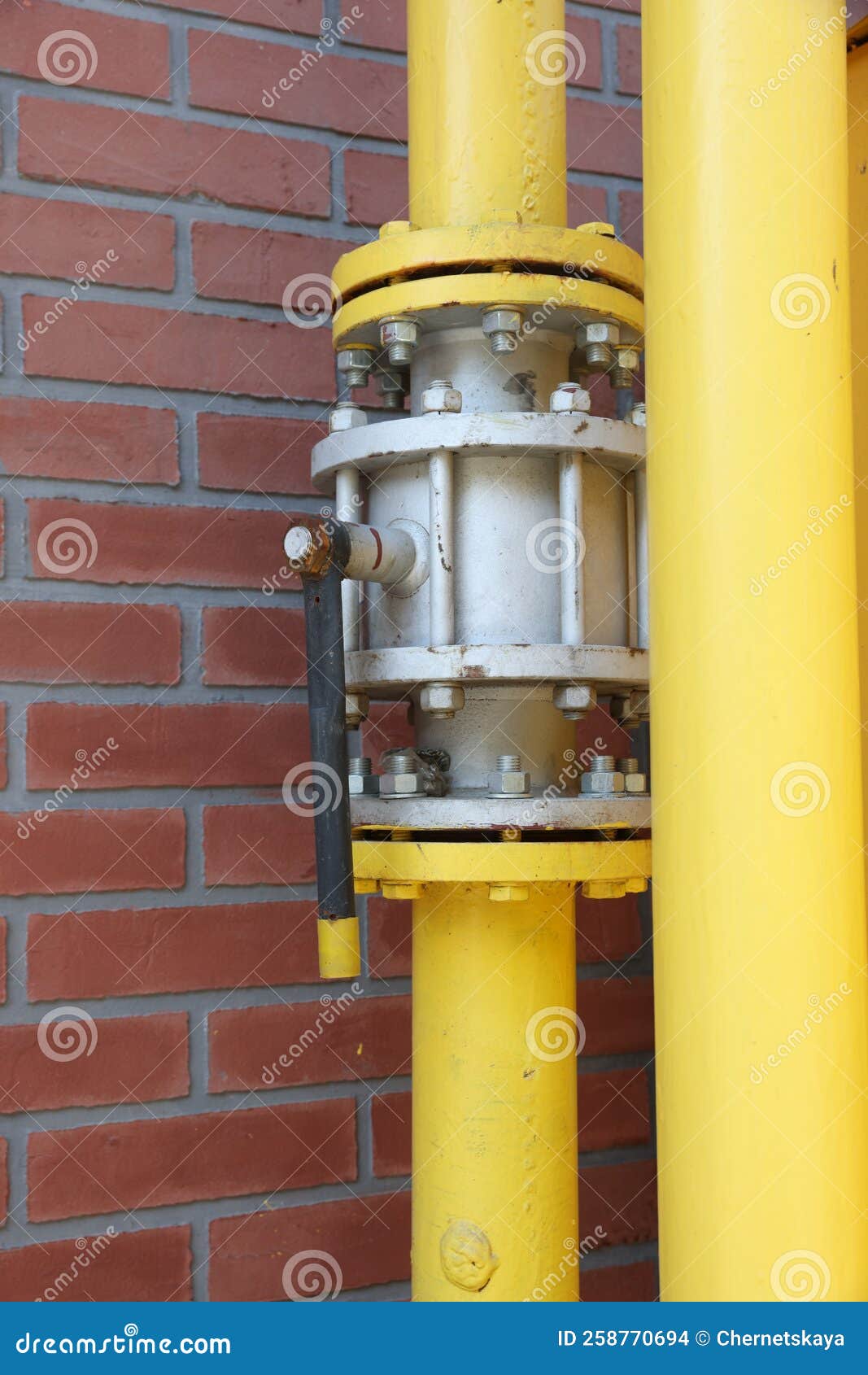 Yellow Gas Pipe Near Red Brick Wall Outdoors Stock Photo - Image of ...