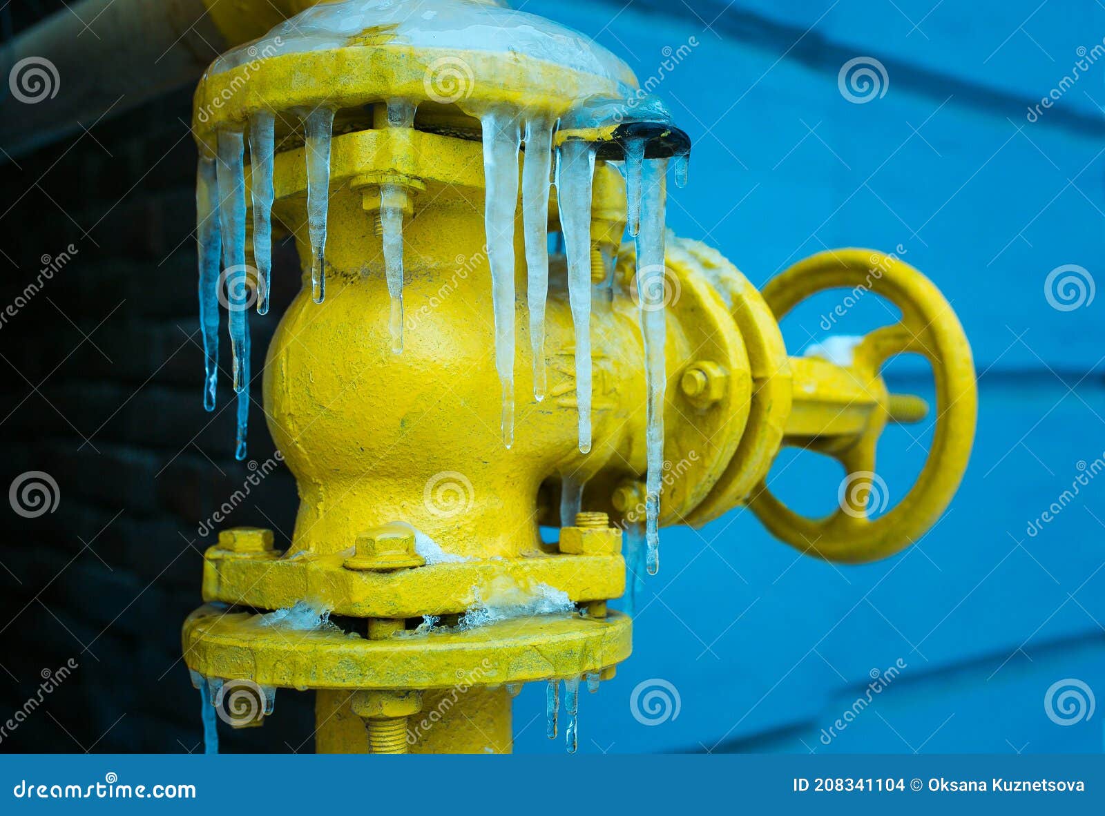 The Yellow Gas Valve is Covered with Ice and Icicles Stock Photo ...
