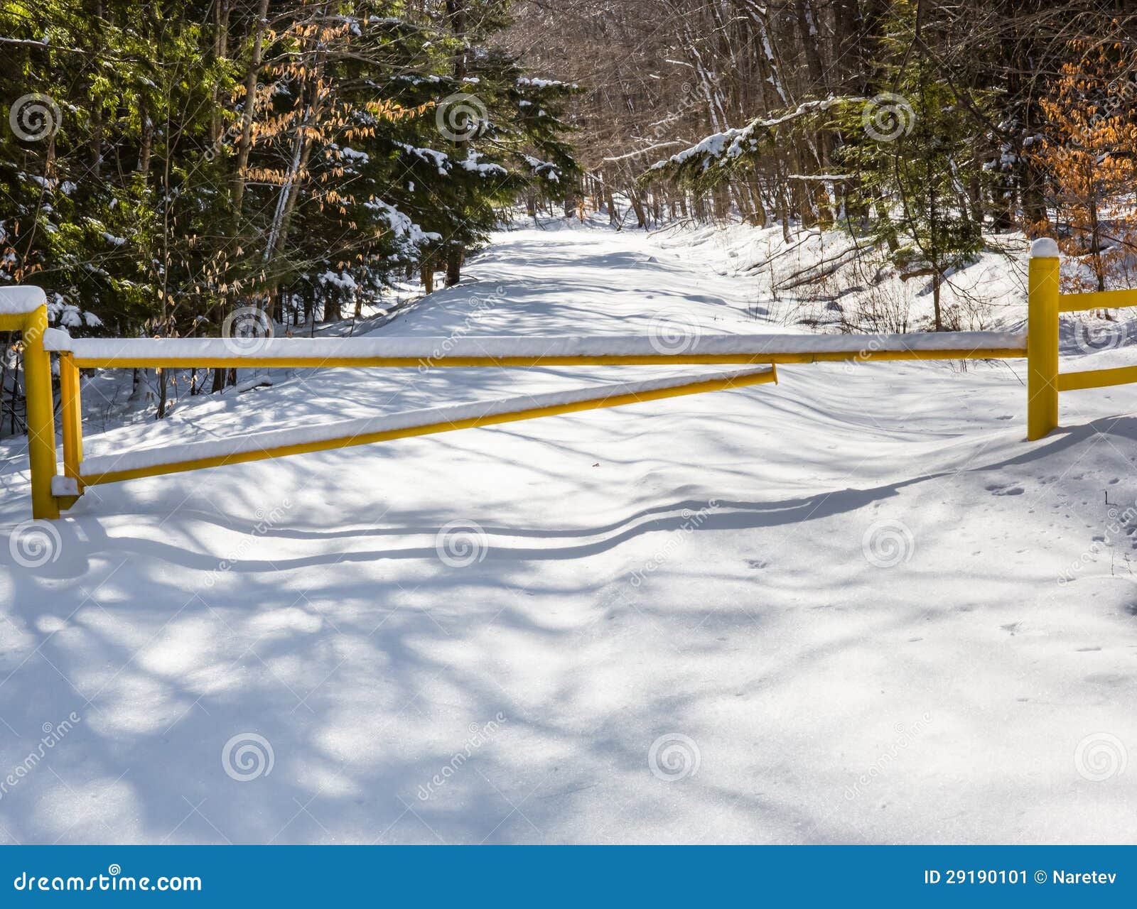 A Yellow Gate Closes a Road for the Winter Stock Image - Image of ...