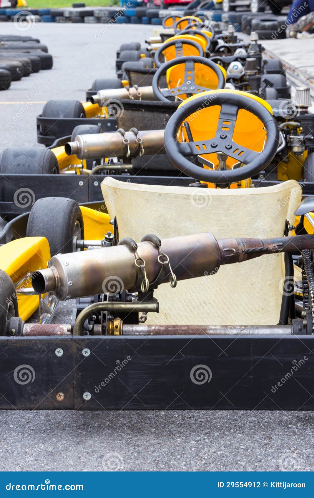 Yellow Go-kart in row stock photo. Image of hobby, perspective - 29554912