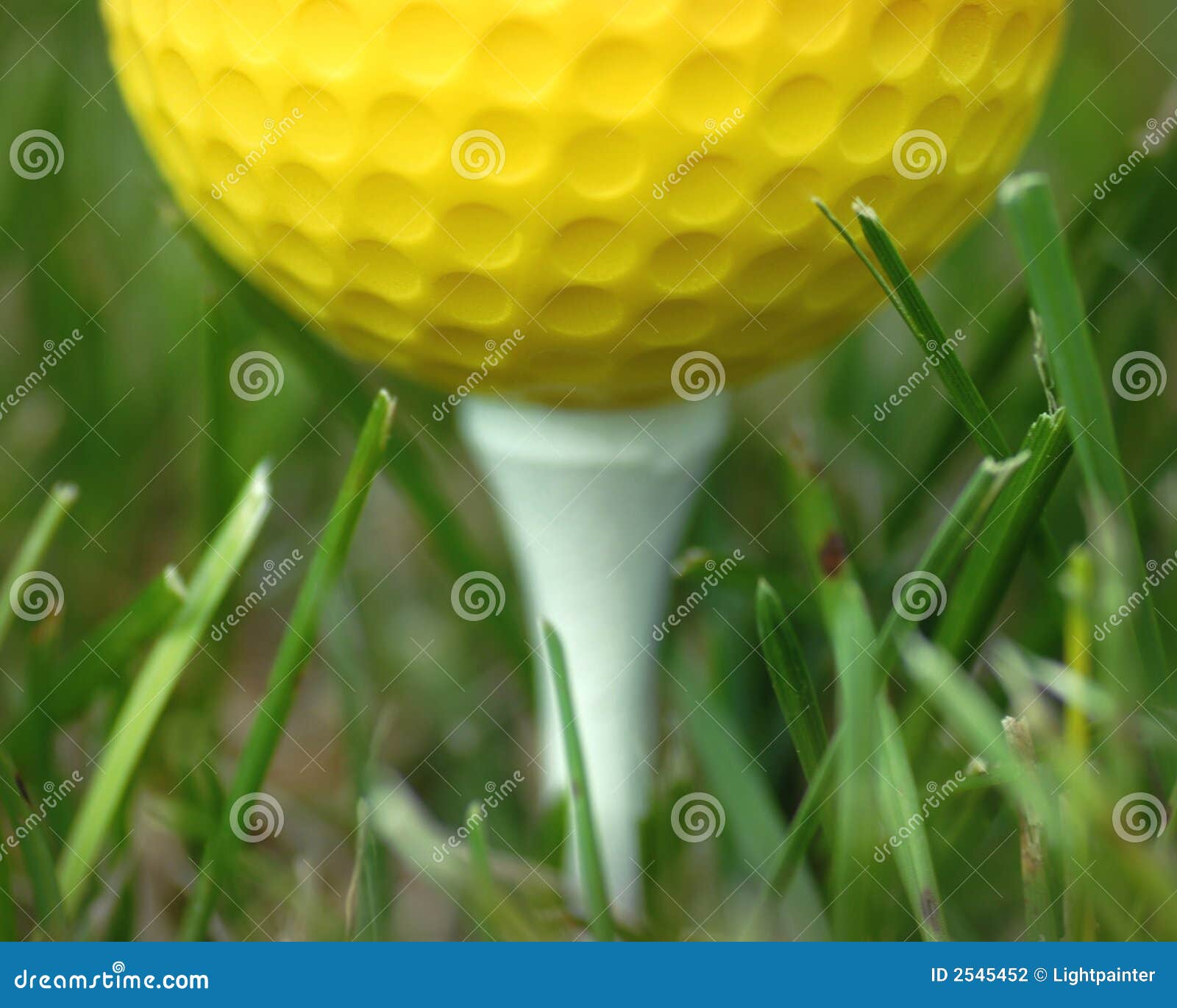 Yellow golf ball on a tee stock photo. Image of sport - 2545452