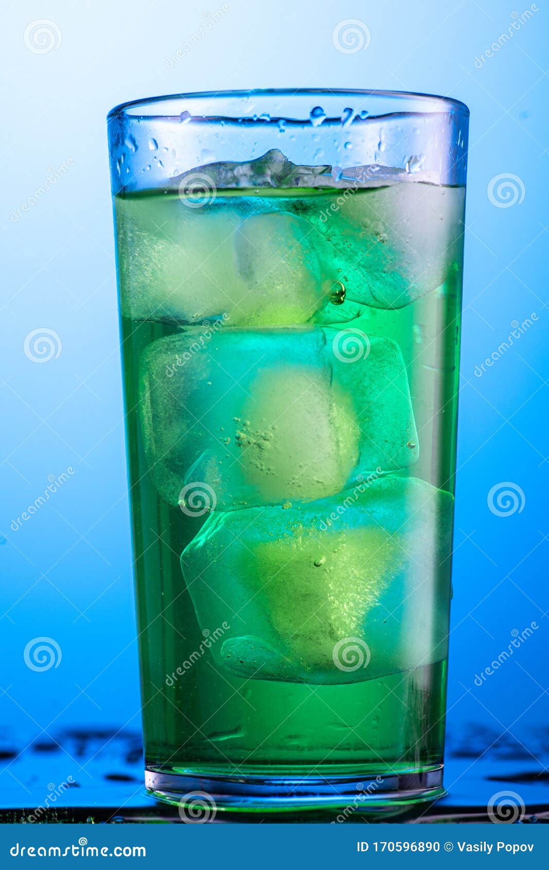 Yellow or Green Carbonated Lemonade in a Glass with Ice, Flow and ...