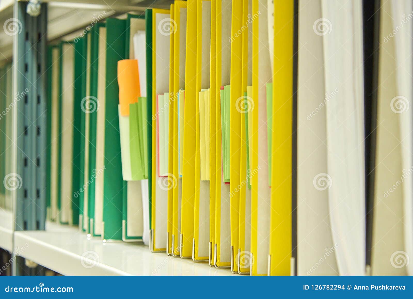 Yellow and Green File Folders in Archive. Stock Photo - Image of ...