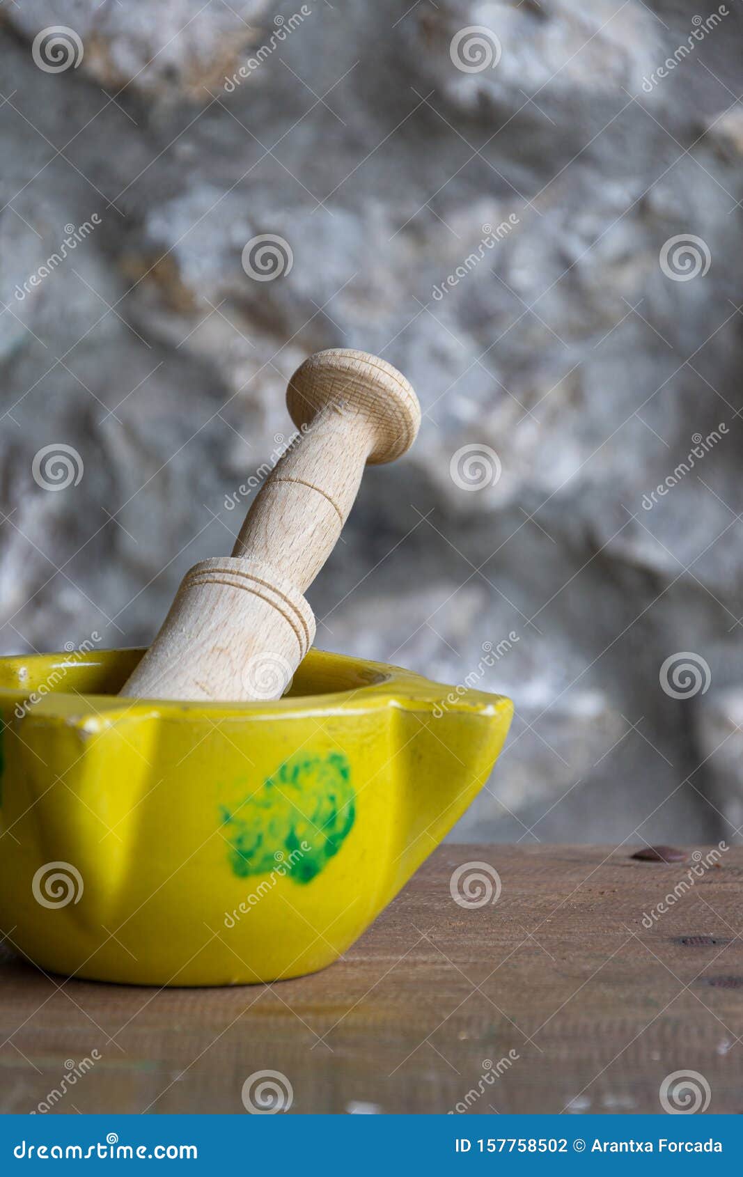 Yellow and Green Mud Mortar on Wooden Table Stock Photo - Image of ...