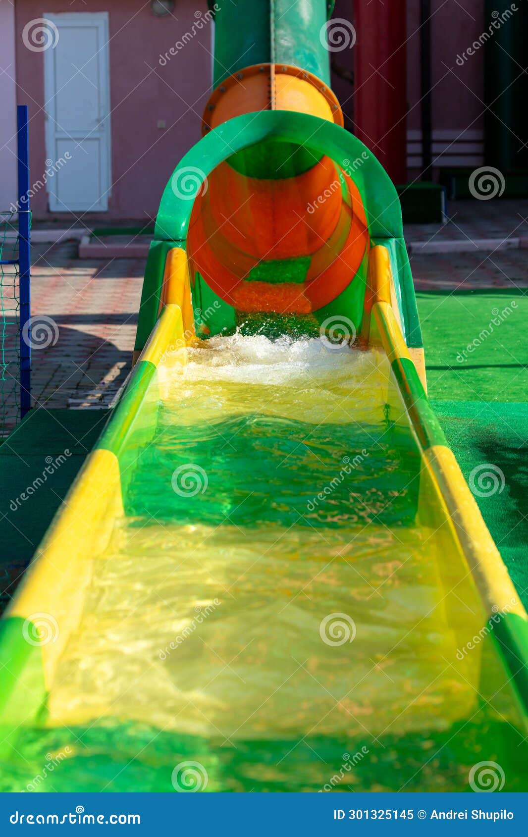Yellow-green Slide in the Pool of the Water Park Stock Image - Image of ...