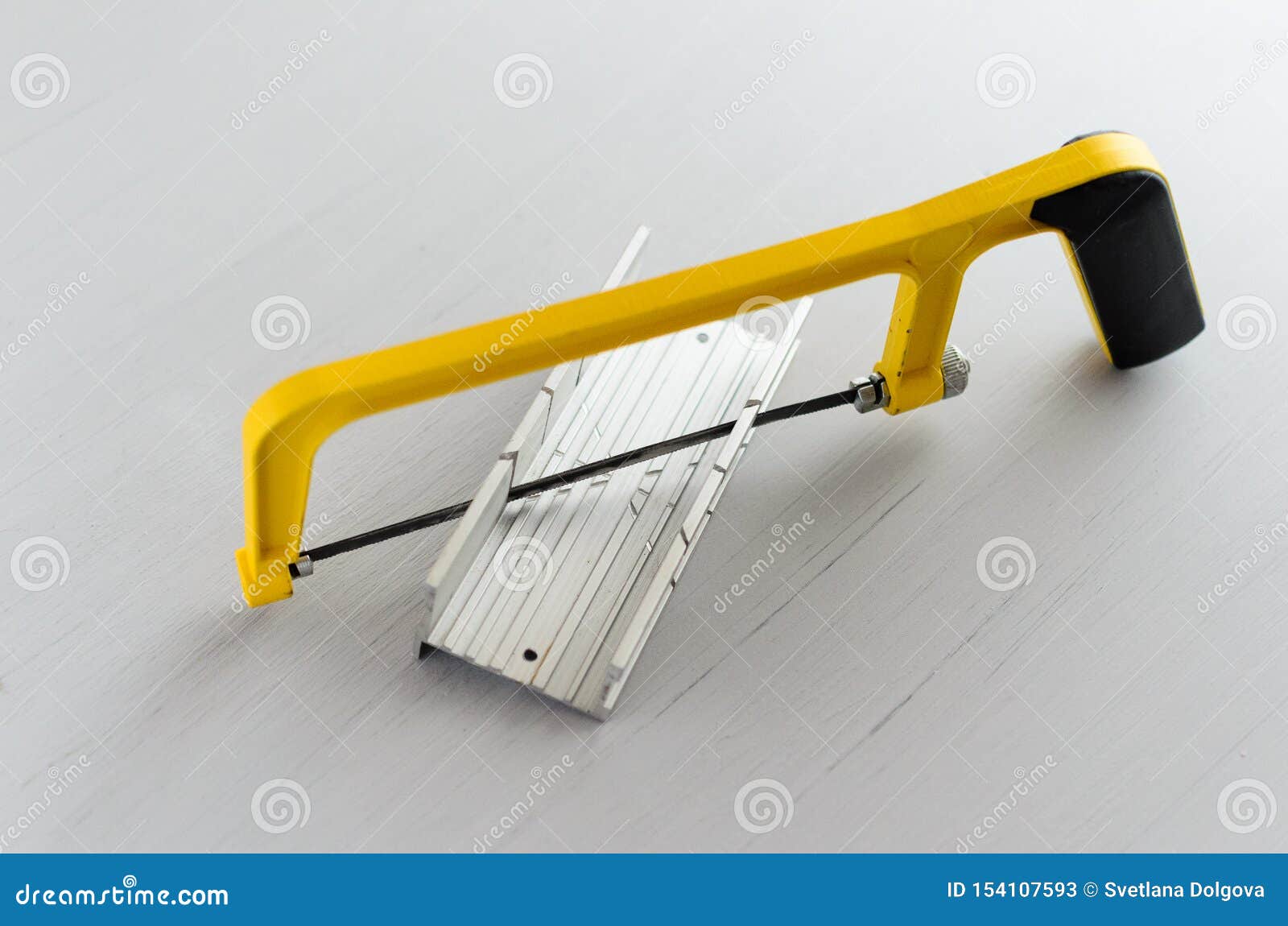 Yellow Hand Saw and Aluminium Miter Box for Hobby in Home Workshop ...