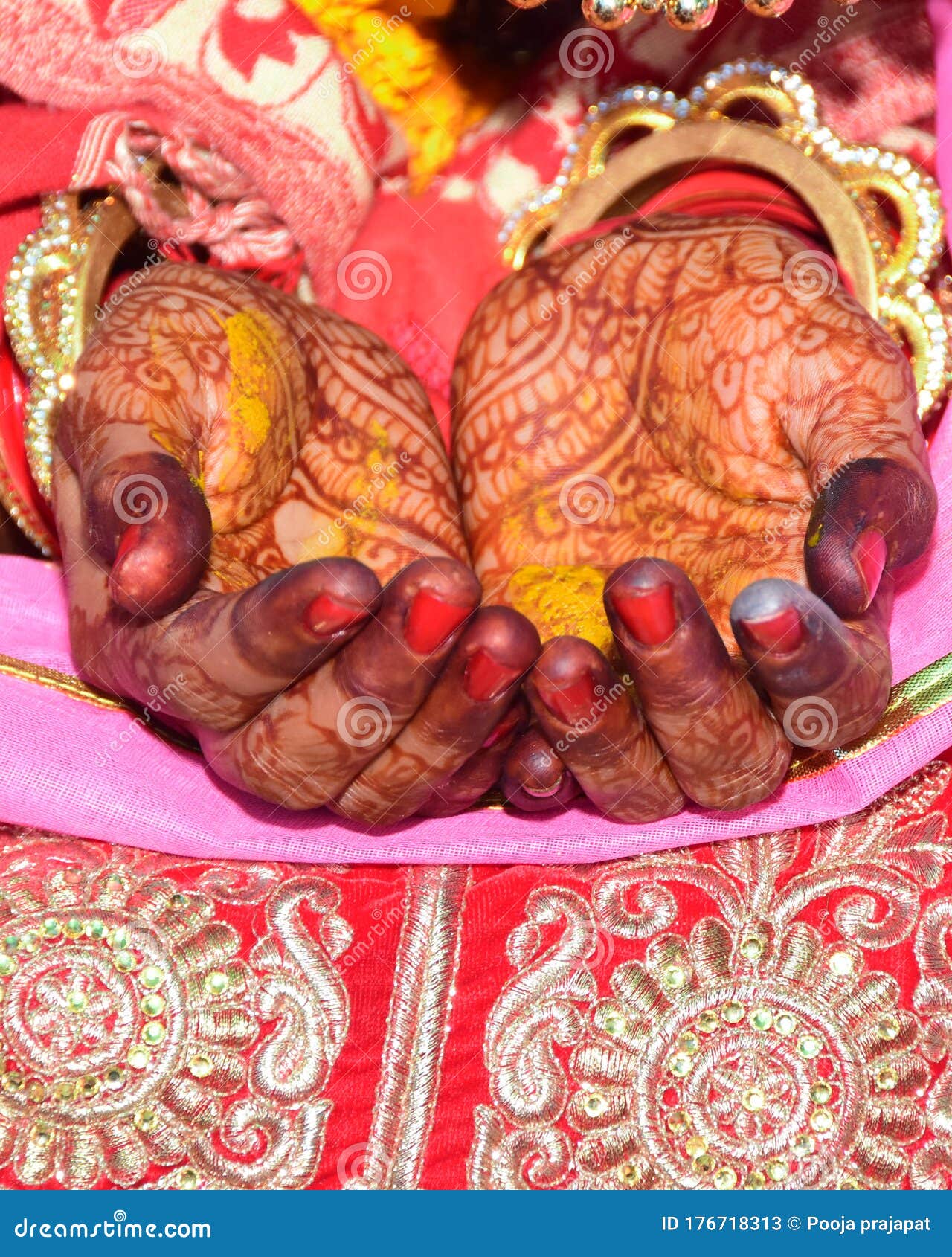 The Yellow Hands of the Bride by the Pandit at an Indian Wedding Stock ...