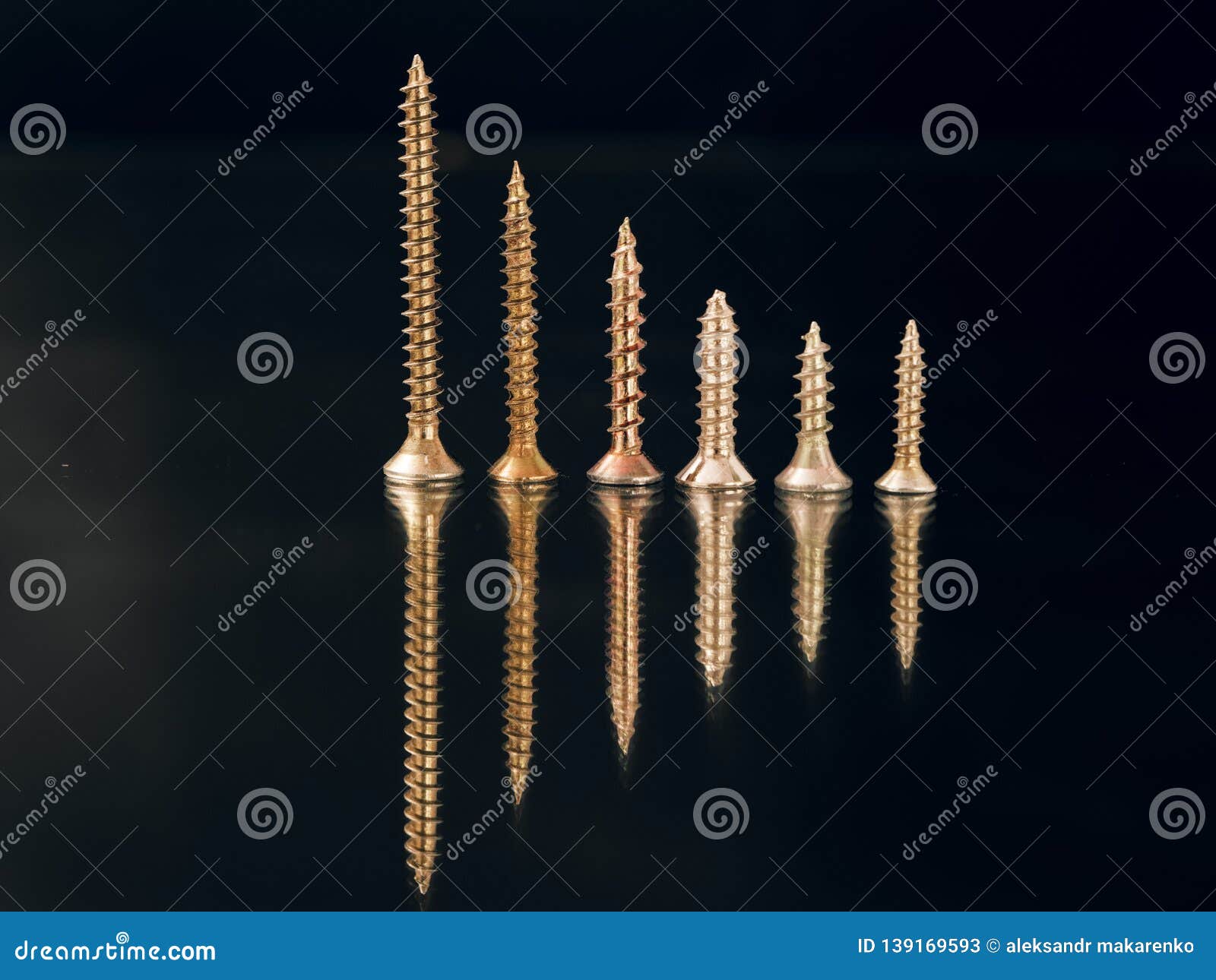 Yellow Hardware Screws on a Black Background Stock Image - Image of ...