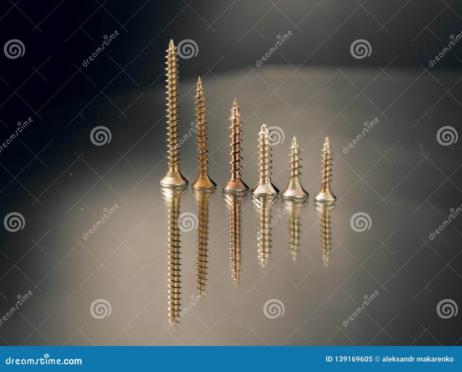 Yellow Hardware Screws on a Black Background Stock Image - Image of ...
