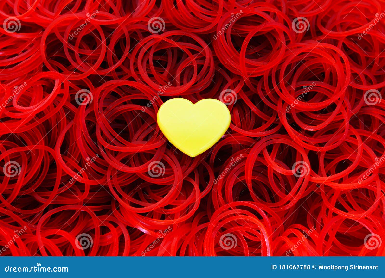 A Yellow Heart in the Middle of the Red Elastic Rubber Bands Stock ...