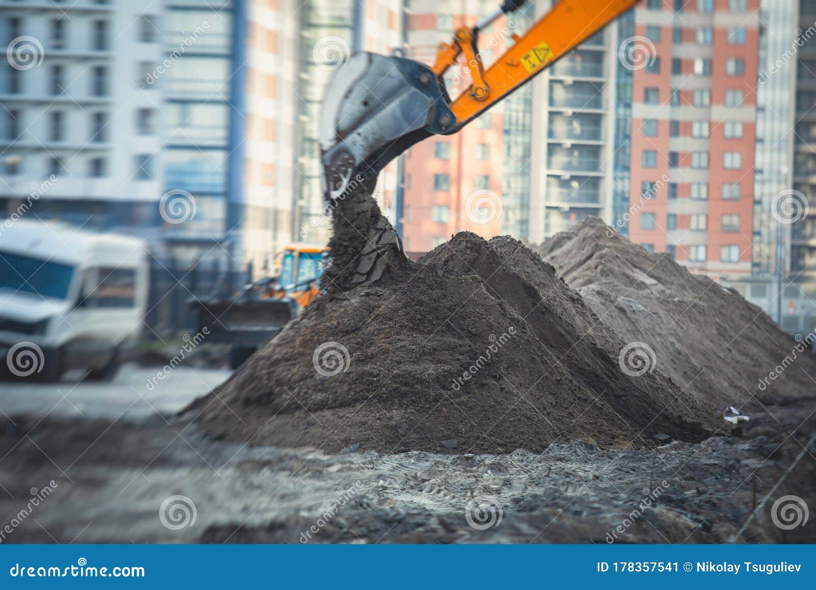 Yellow Heavy Excavator Excavating Sand and Working during Road Works ...