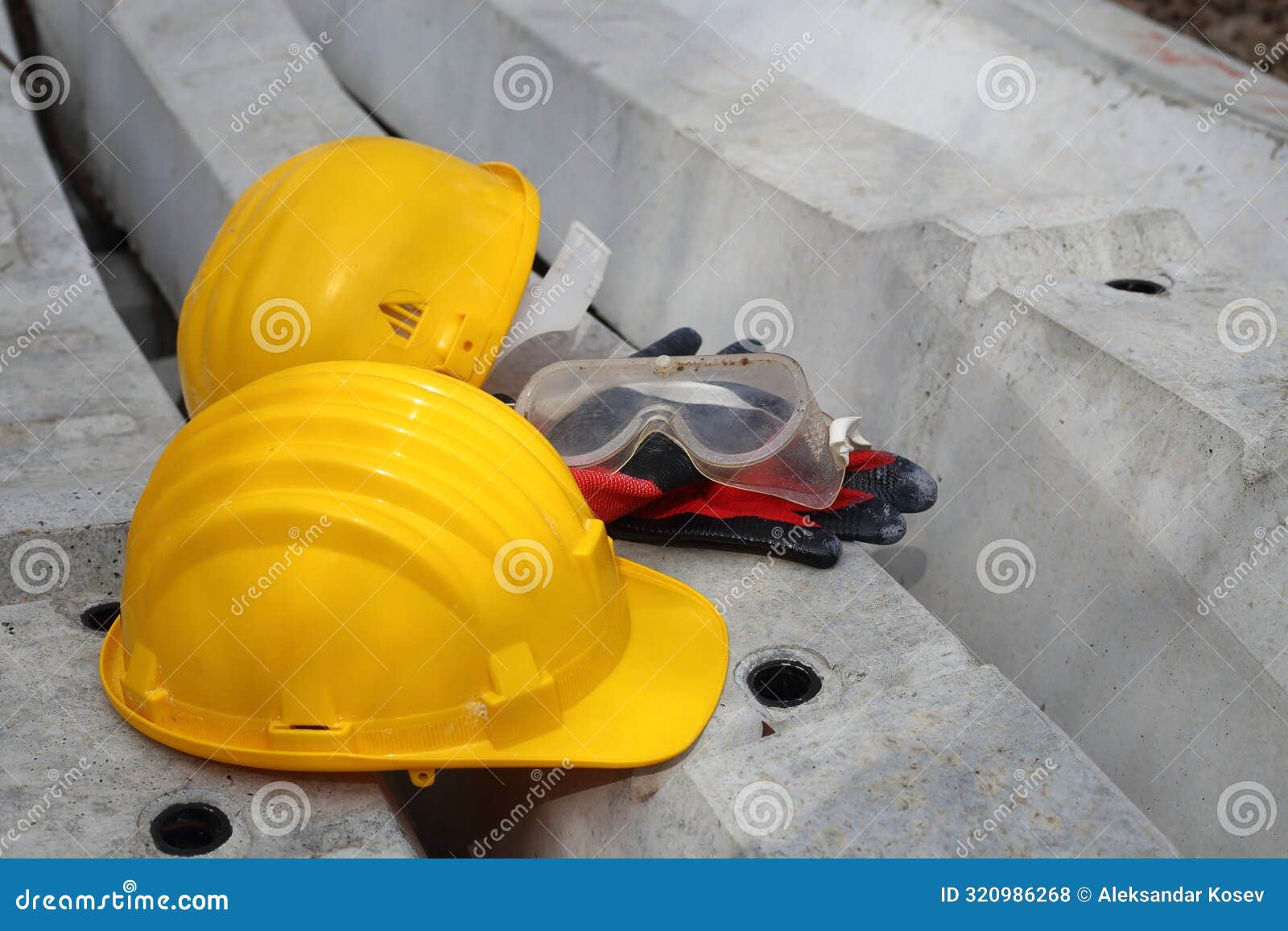 Yellow Helmet on a Work Site Stock Photo - Image of plastic, white ...
