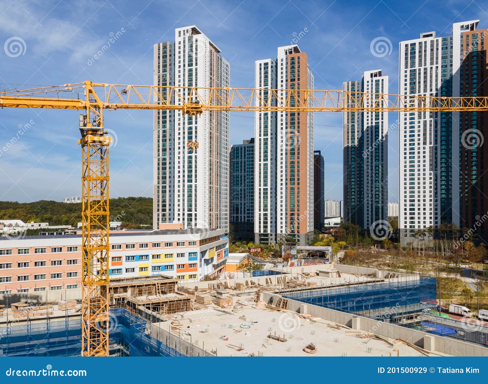 Yellow Hoisting Crane and Buildings Under Construction, Front View ...