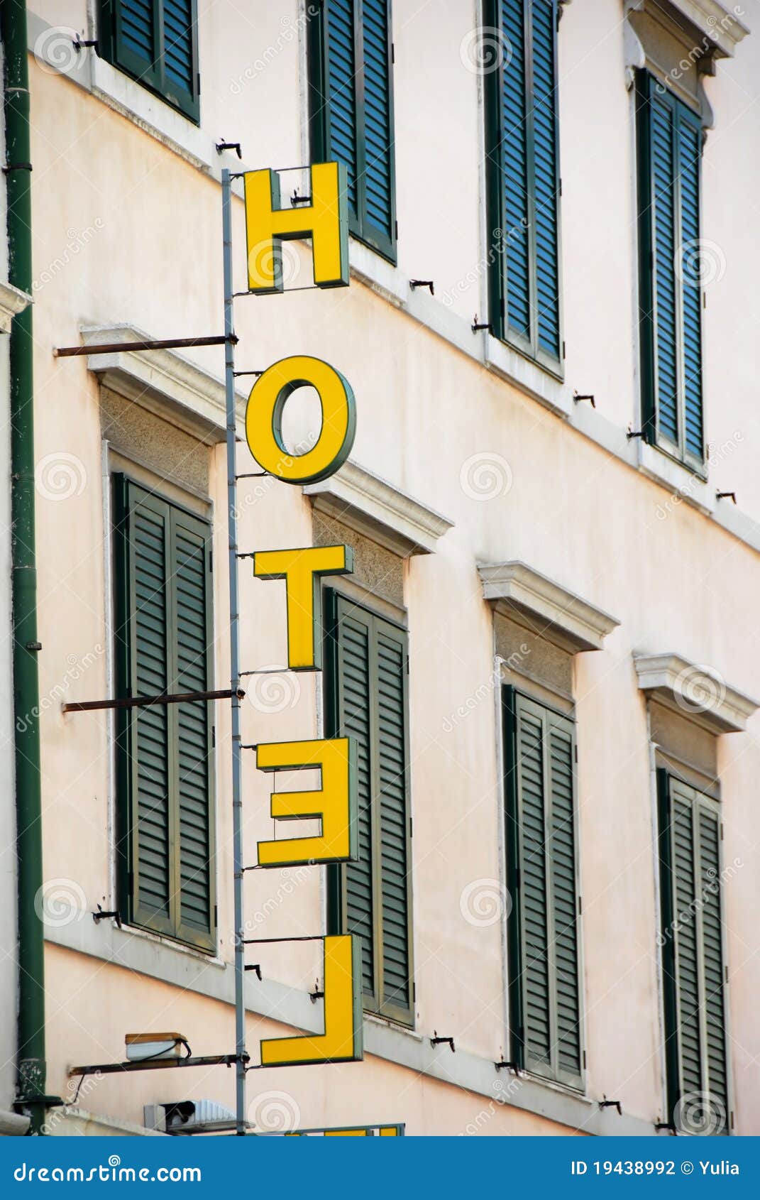 Yellow hotel sign stock photo. Image of town, architectural - 19438992