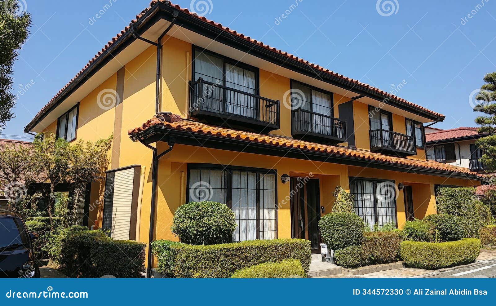 Yellow House with BalconiesCharming Yellow House with Elegant Balconies ...