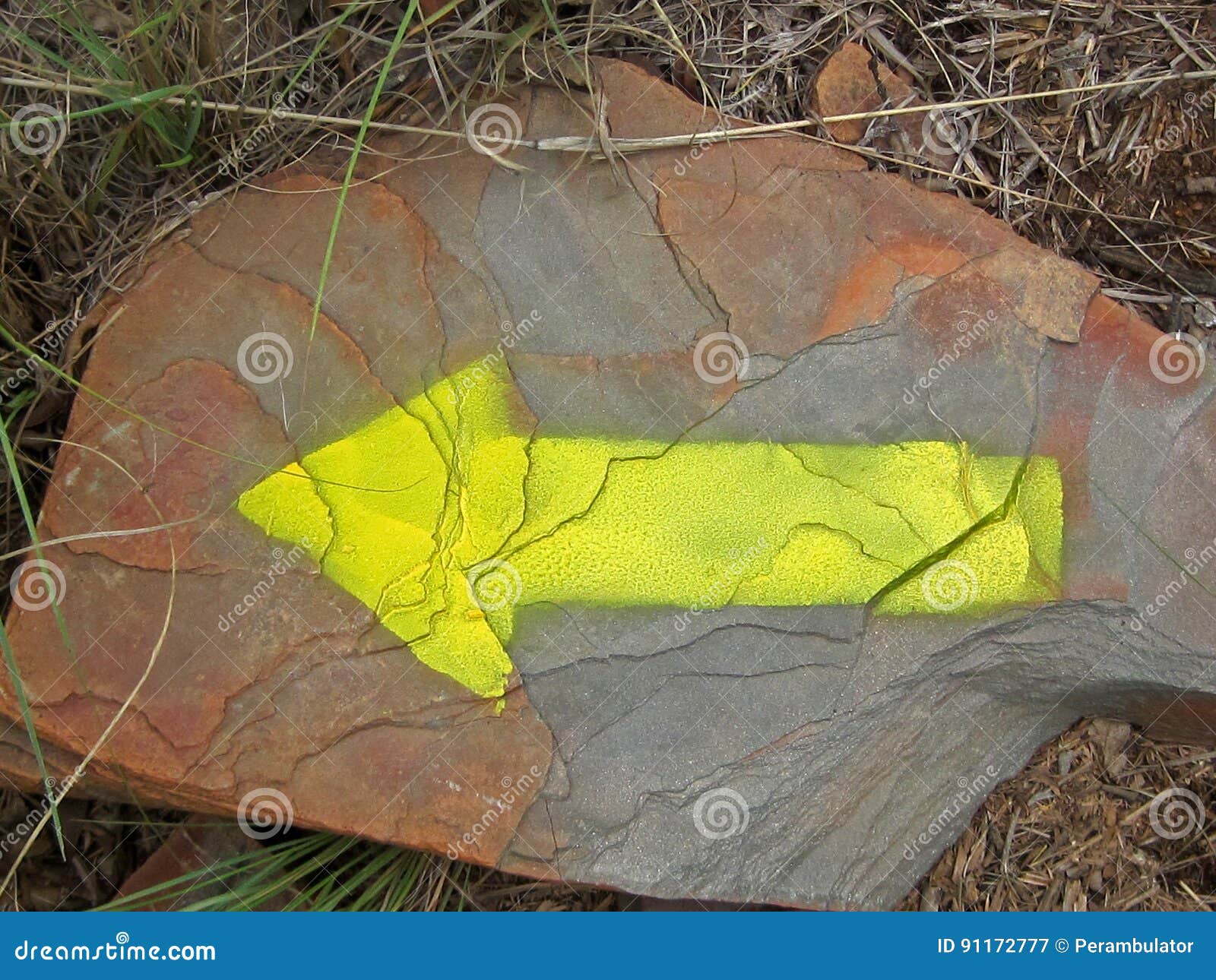 YELLOW INDICATOR ARROW on ROCK Stock Image - Image of summer, track ...