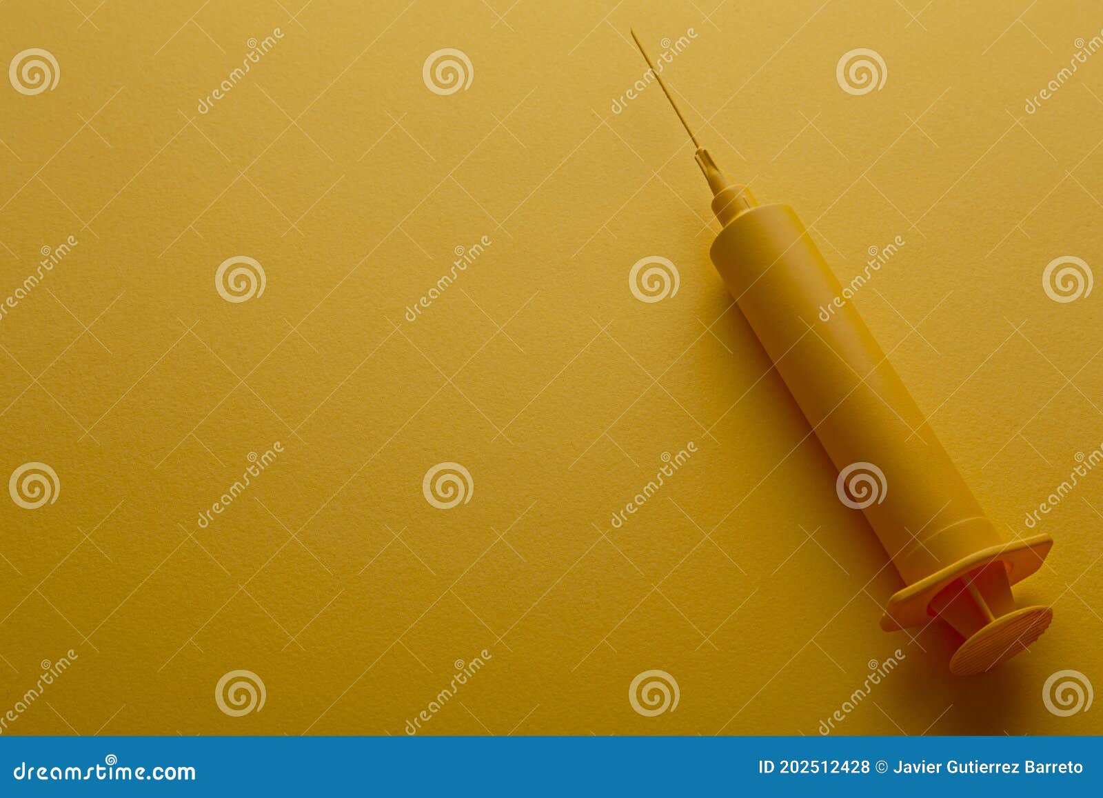 Yellow Injection Syringe on Yellow Background Stock Photo - Image of ...