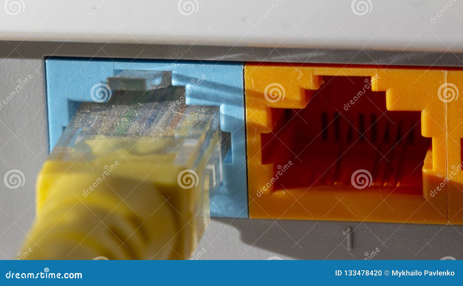 Yellow Internet Cable in Blue on the Back of the Network Router Stock ...