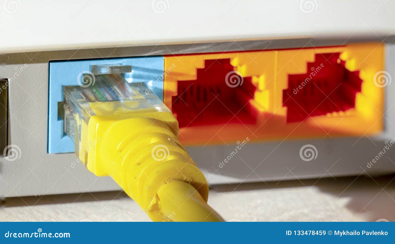 Yellow Internet Cable in Blue on the Back of the Network Router Stock ...