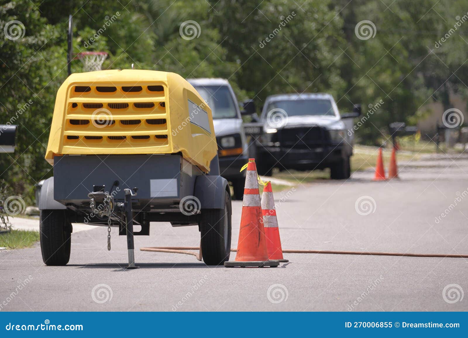 Yellow Jackhammer Machine with Compressor Trailer on Road Construction ...