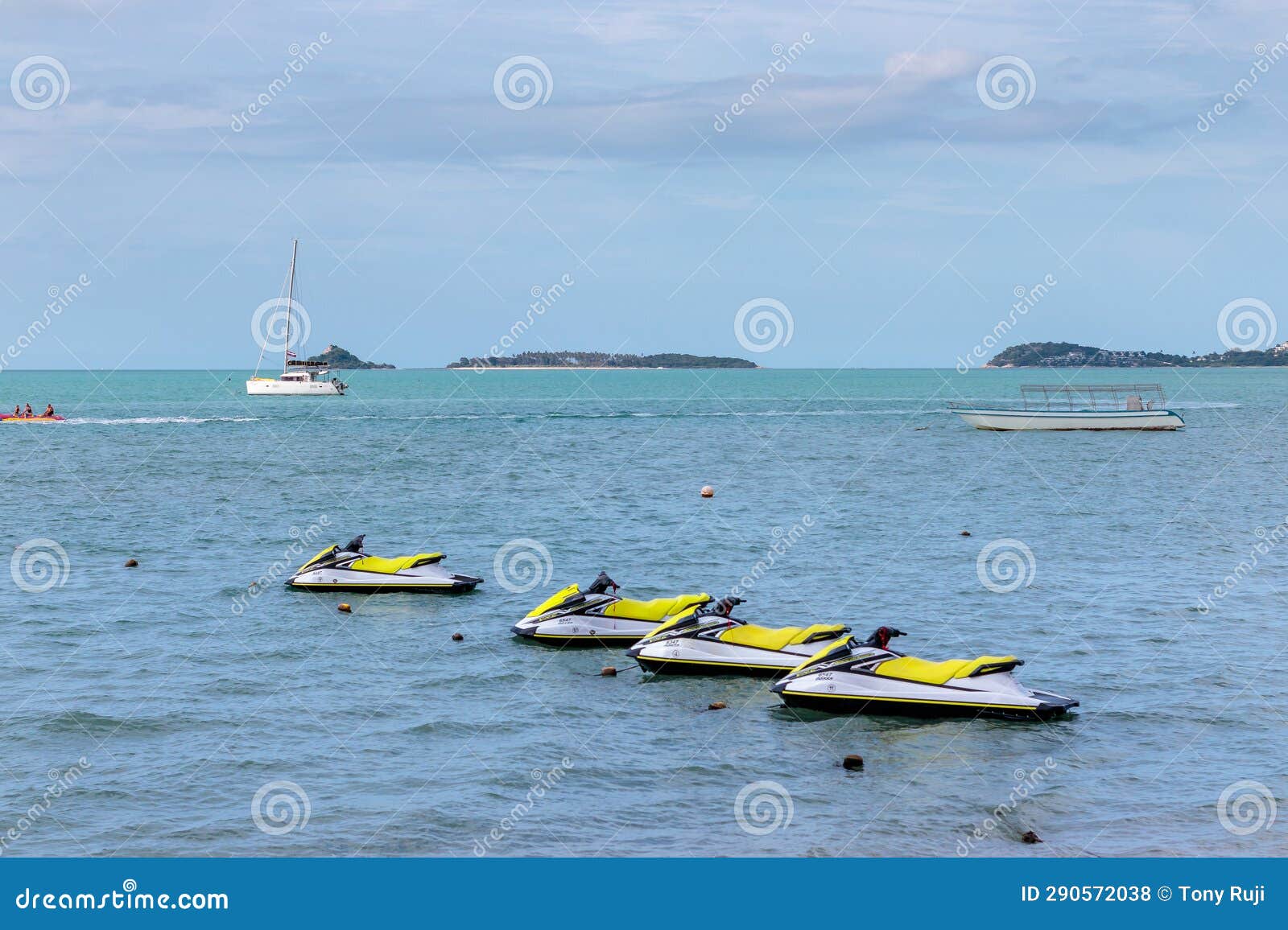 Yellow Jet Ski Floating in Bay Stock Photo - Image of holidays, action ...