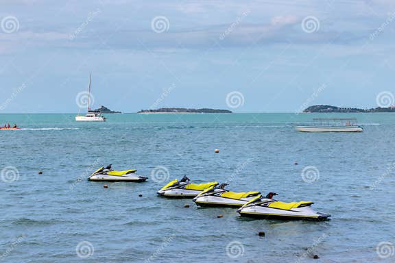 Yellow Jet Ski Floating in Bay Stock Photo - Image of holidays, action ...