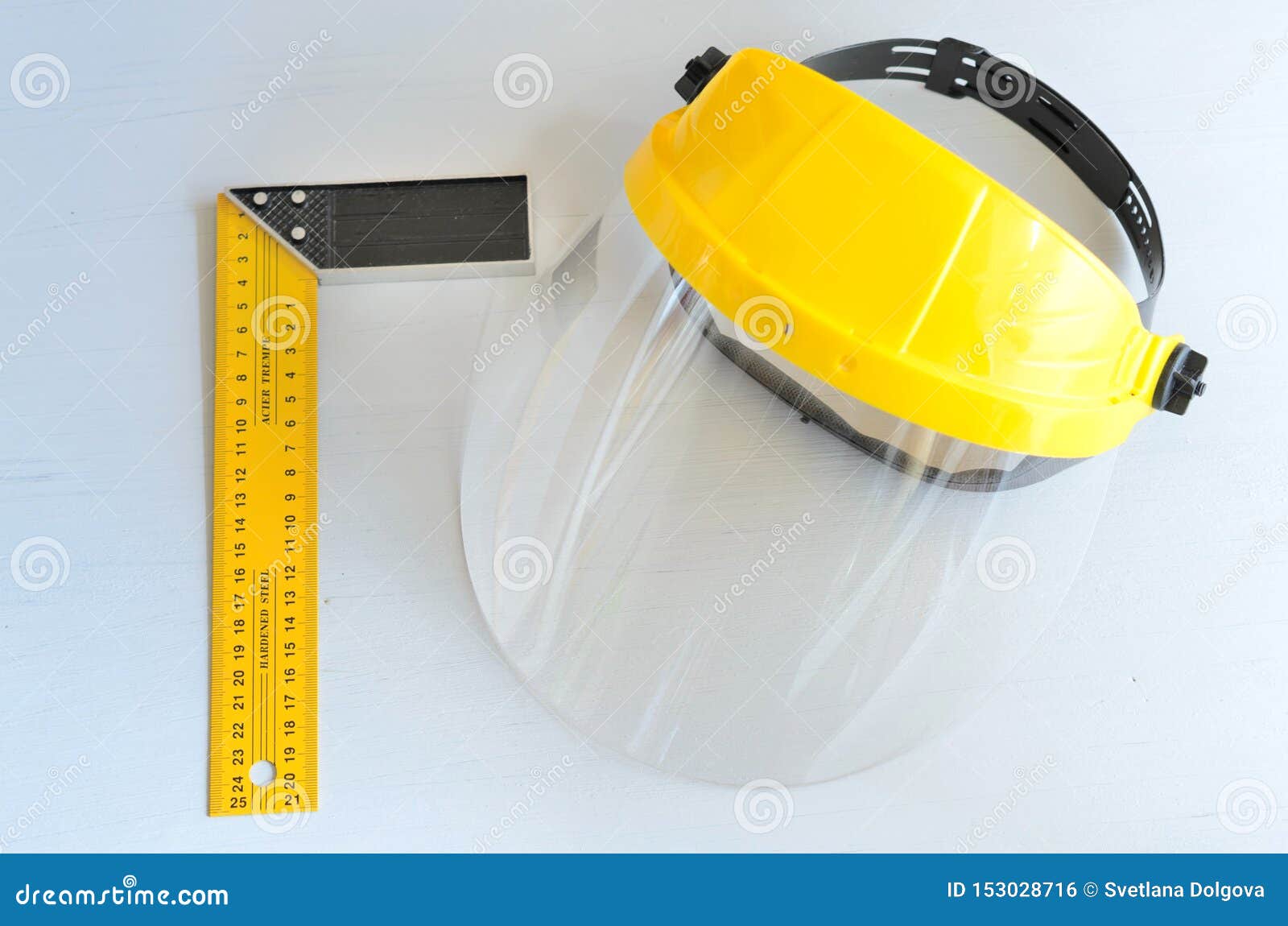 Yellow Joiner`s Ruler and Face Shield for Home Workshop Stock Photo ...