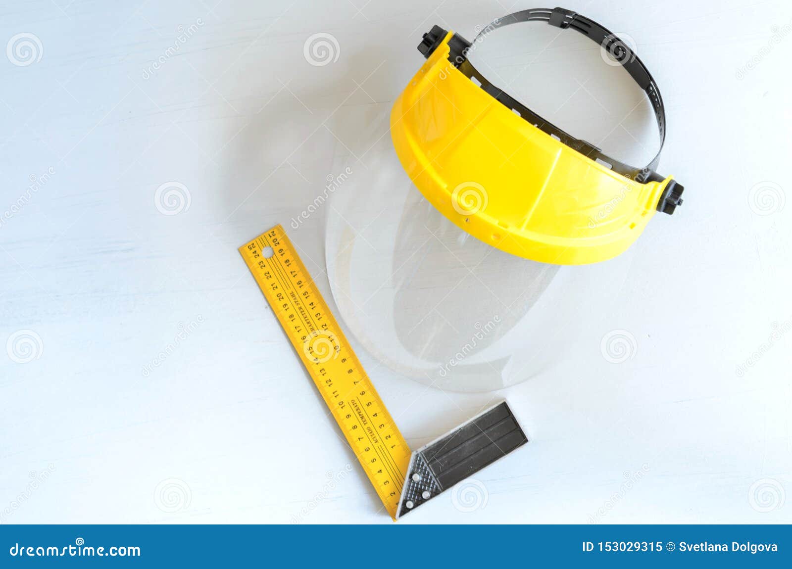 Yellow Joiner`s Ruler and Face Shield for Home Workshop Stock Image ...