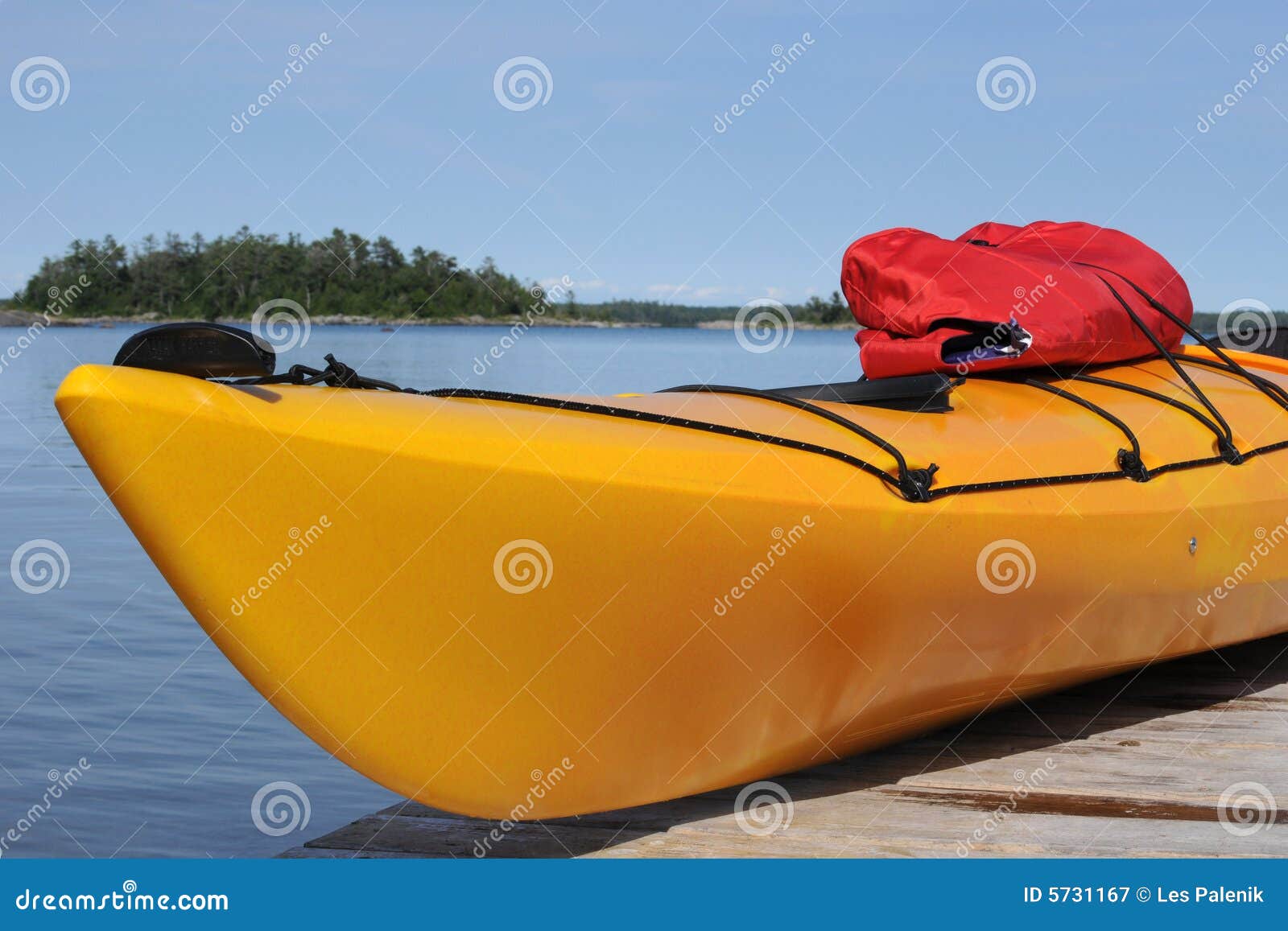 Yellow kayak stock image. Image of jacket, wood, boat - 5731167