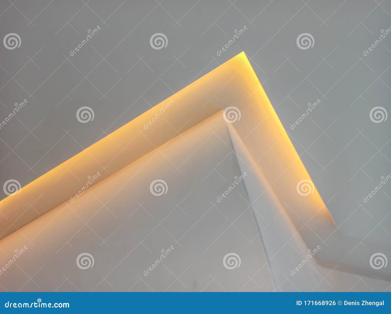 Yellow LED Light on White Wall. Abstract Background. Place for Logo ...