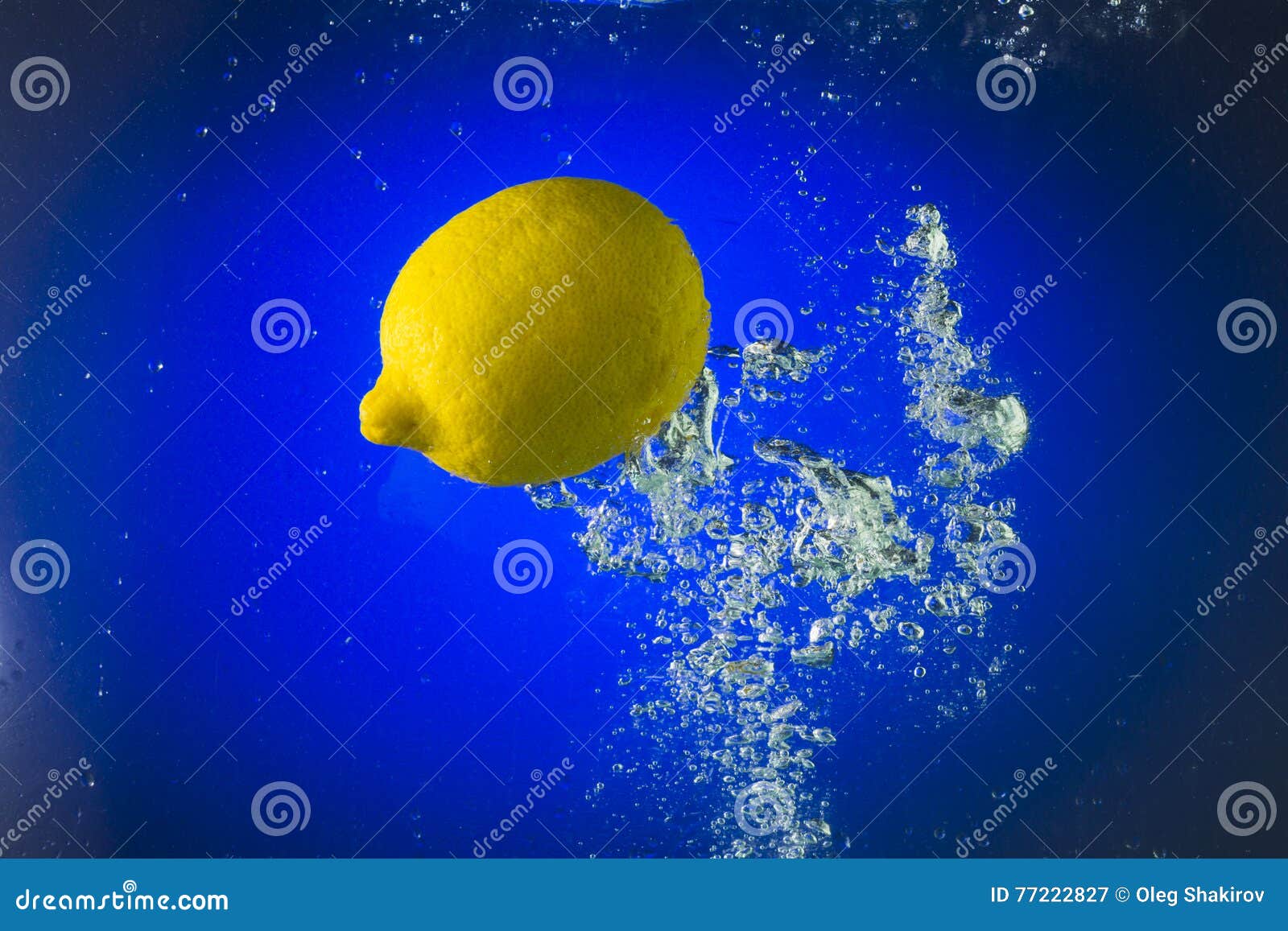 Yellow Lemon Floating in the Water on a Blue Background Stock Image ...