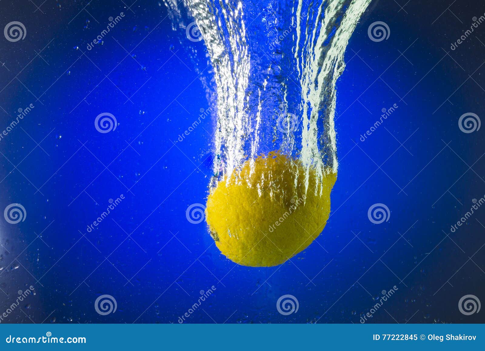 Yellow Lemon Floating in the Water on a Blue Background Stock Image ...