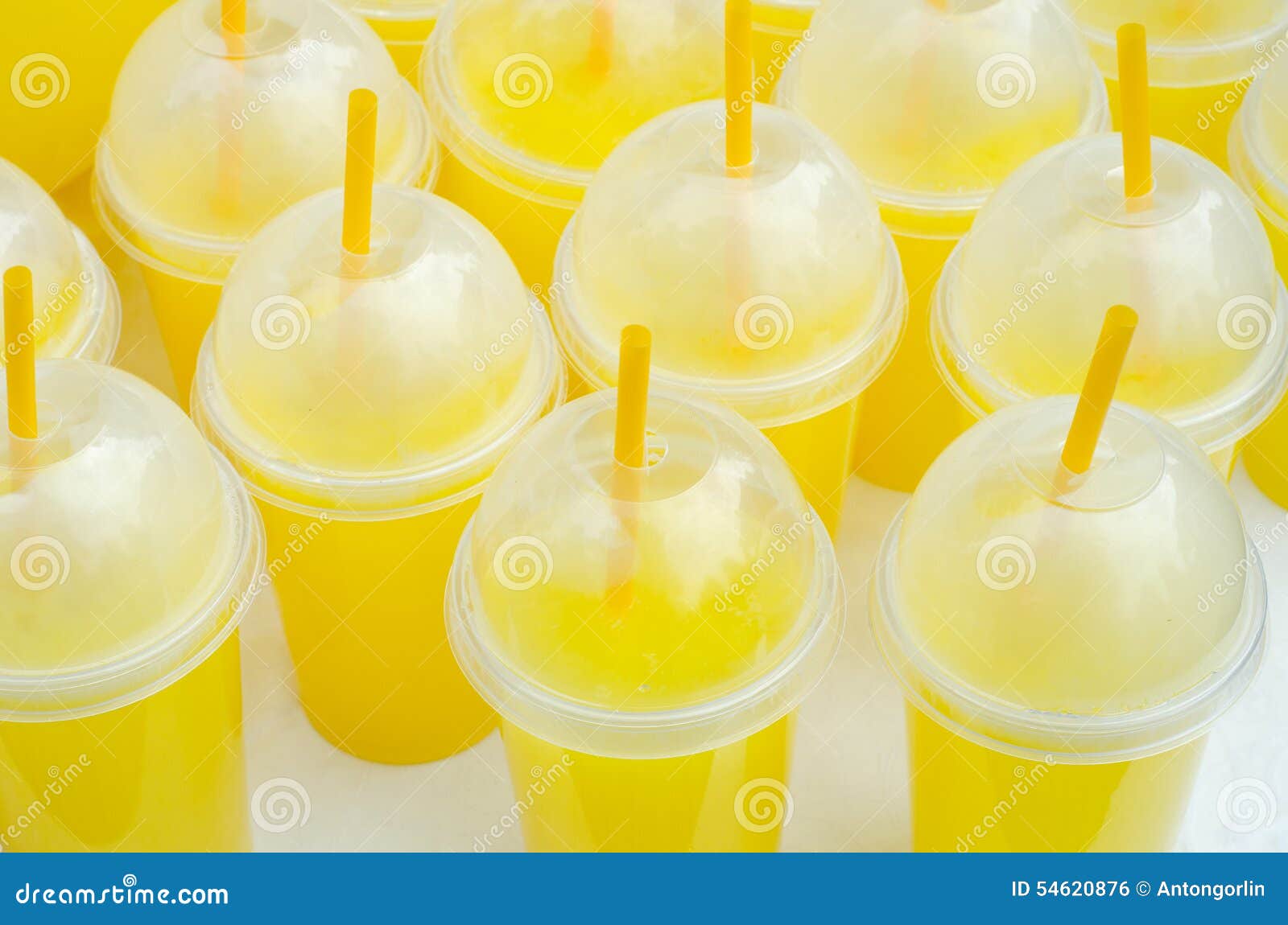 Yellow Lemonade Plastic Cups Stock Photo - Image of lemon, portion ...