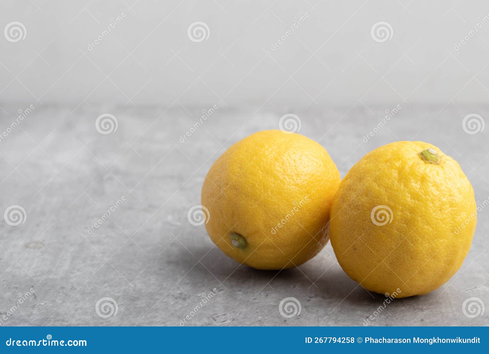 Yellow Lemons on a Gray Background Stock Photo - Image of nourishment ...